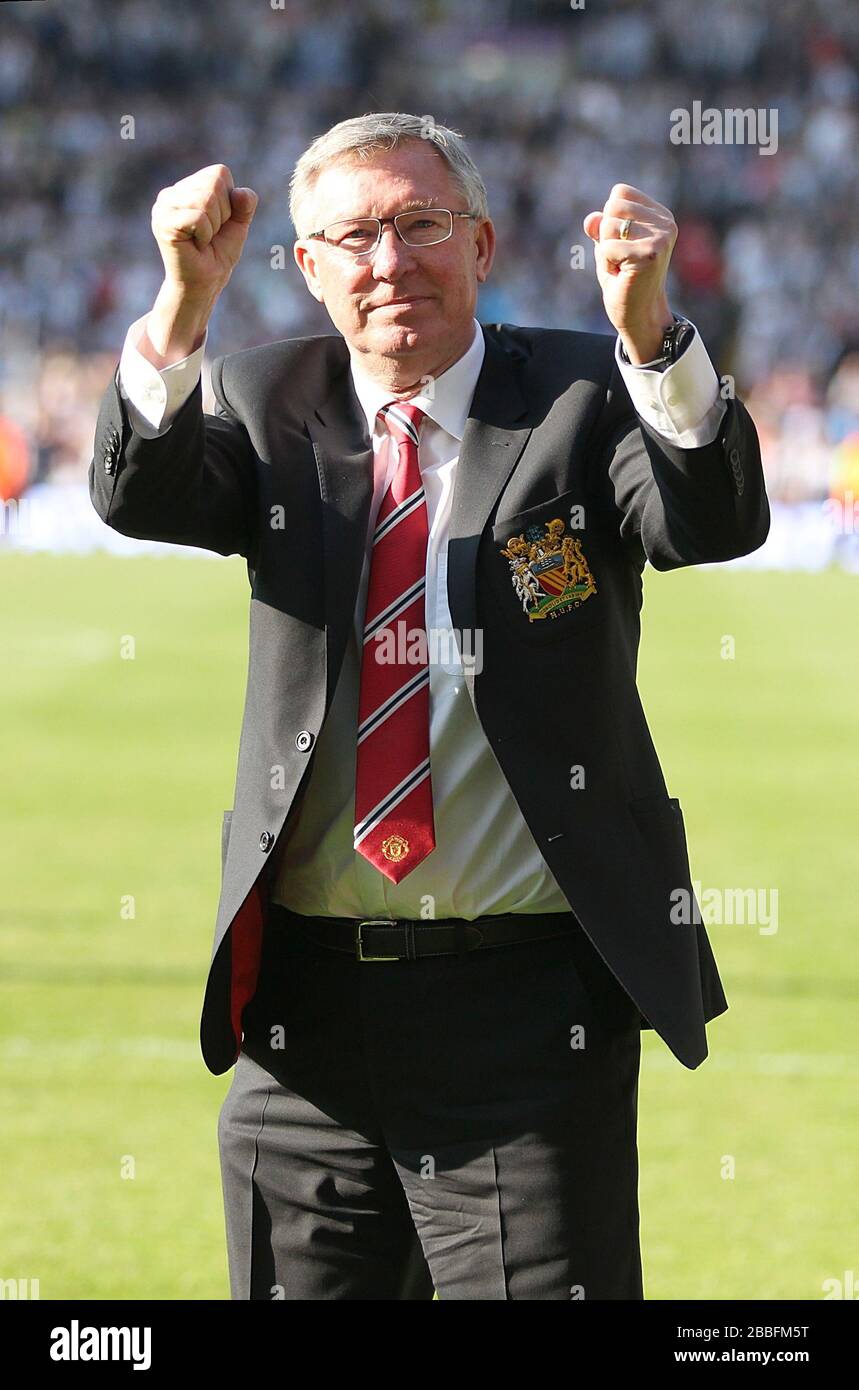 Manchester United manager Sir Alex Ferguson acknowledges the fans after ...