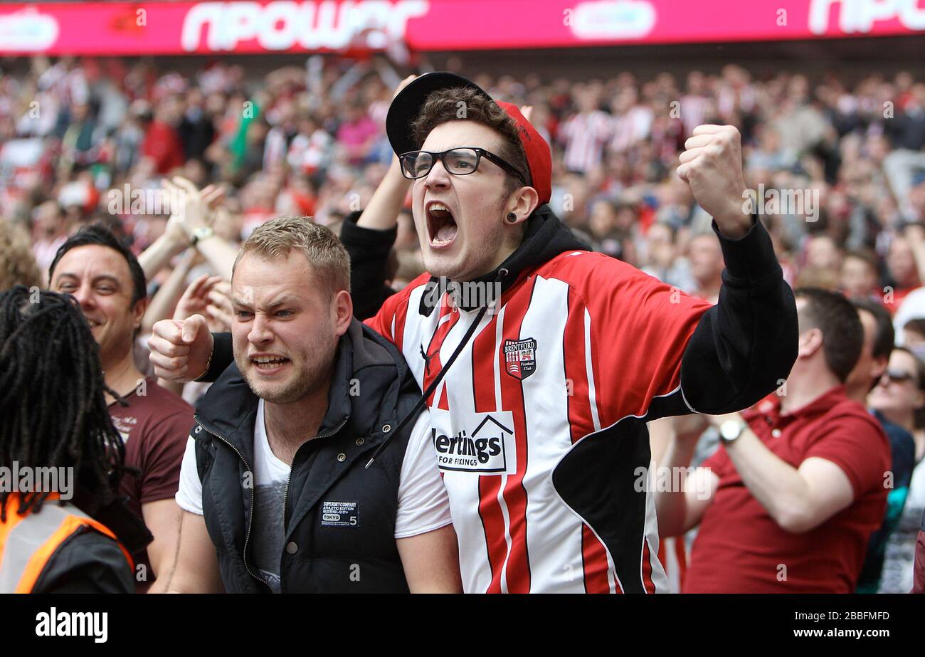 Brentford fans cheer on their side in the stands Stock Photo - Alamy