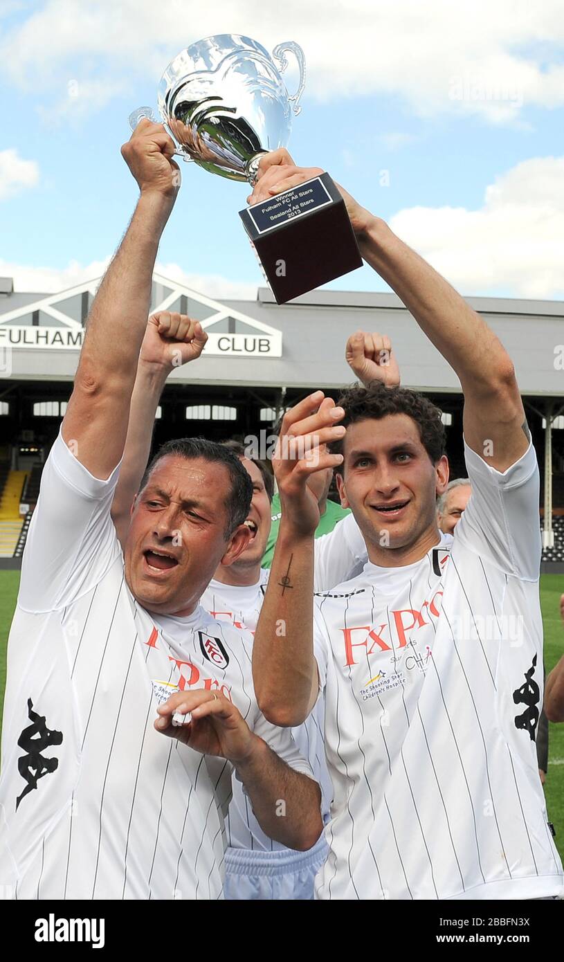 Fulham's Karim Fayed (right) lifts the trophy with Neil Smith Stock ...