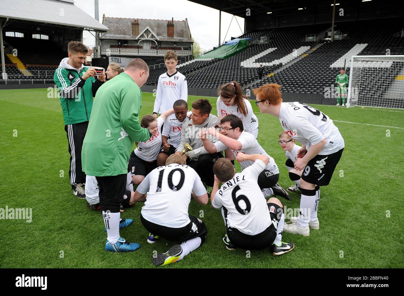 Children celebrate after playing football on the pitch before the ...