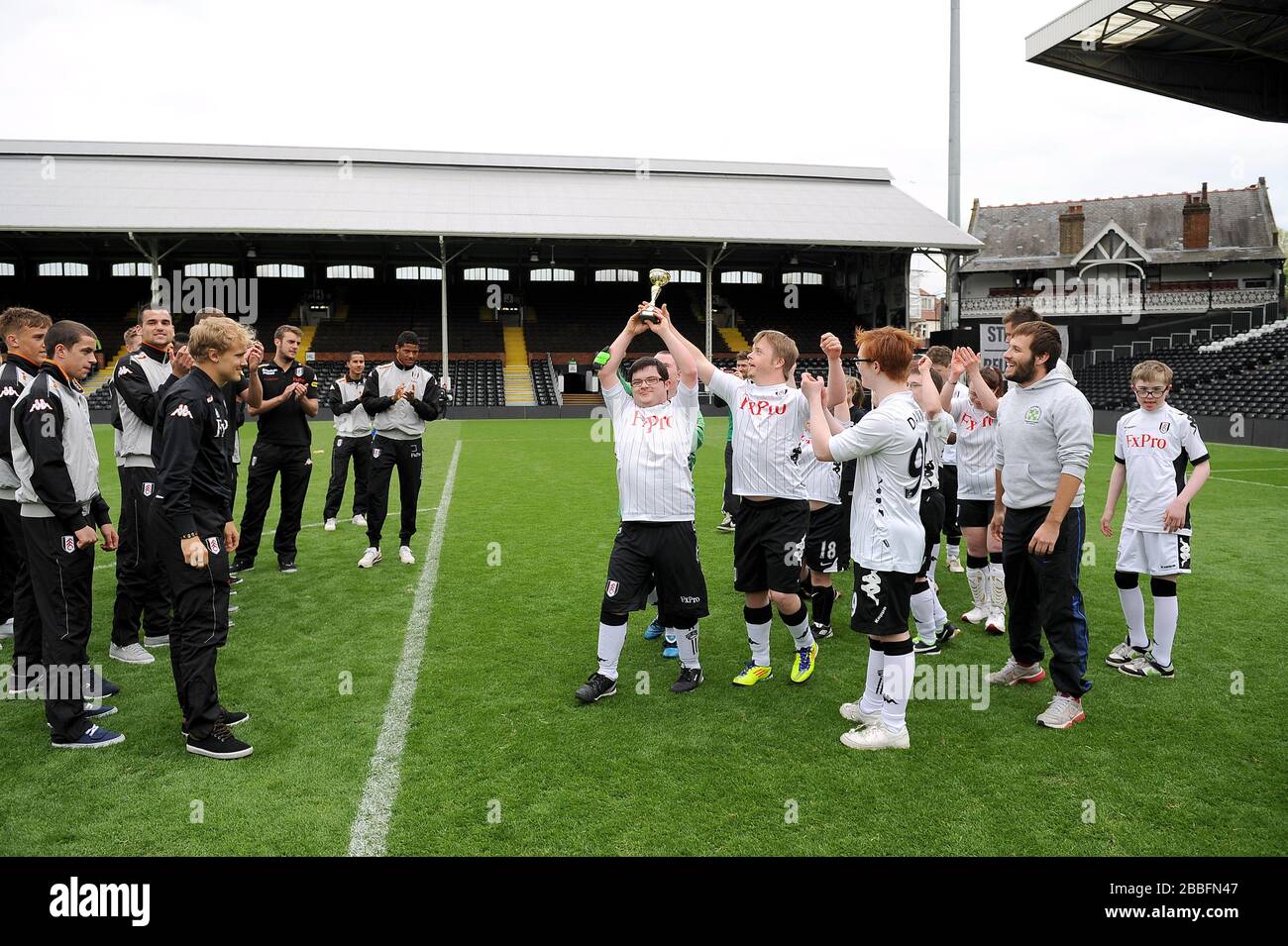 Children celebrate after playing football on the pitch before the ...