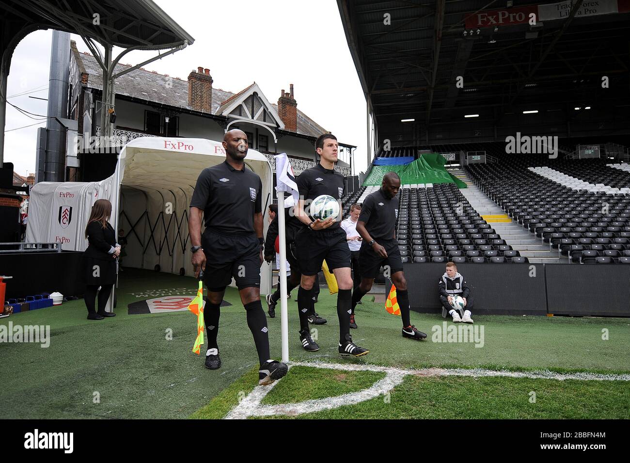 Referee Adrian Waters leads out his assistants for the start of the ...