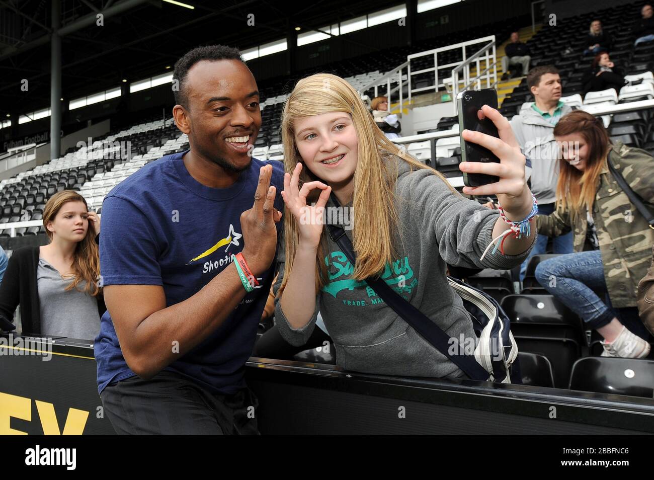 Sealand's Temi Williams poses for a photo with a fan before the game ...
