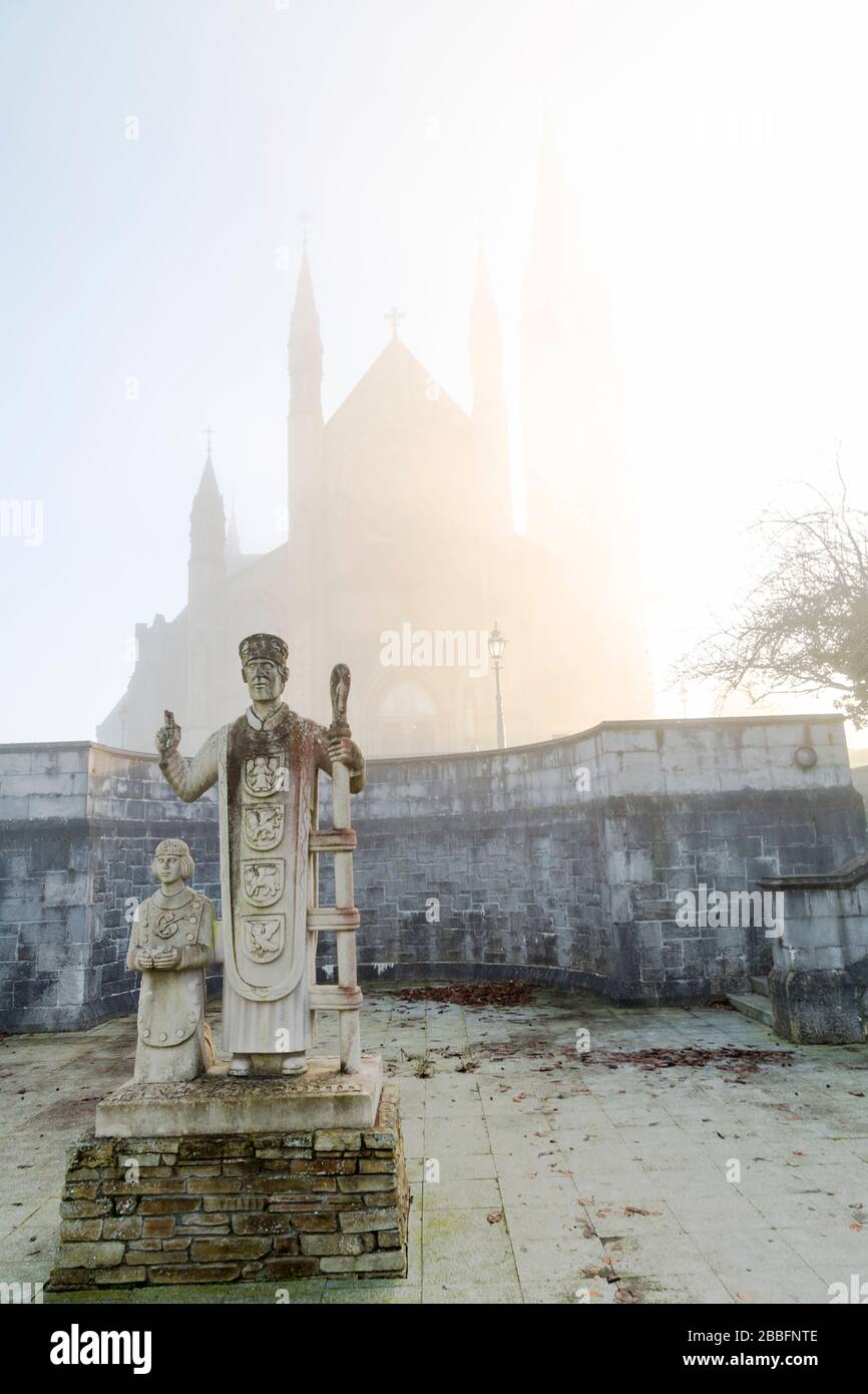 Statue of St. Macartan and St. Patrick outside a foggy St. Macartan's ...