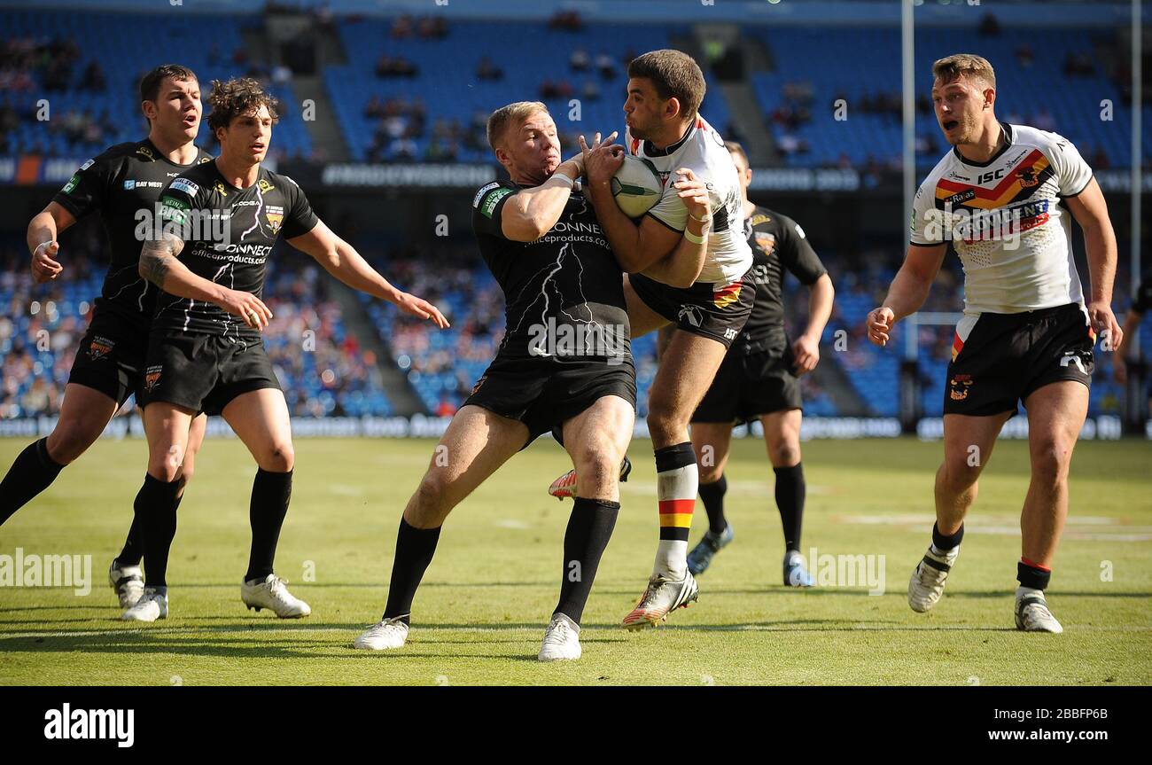 Bradford Bulls' Elliott Kear is tackled by Huddersfield Giants' Aaron ...