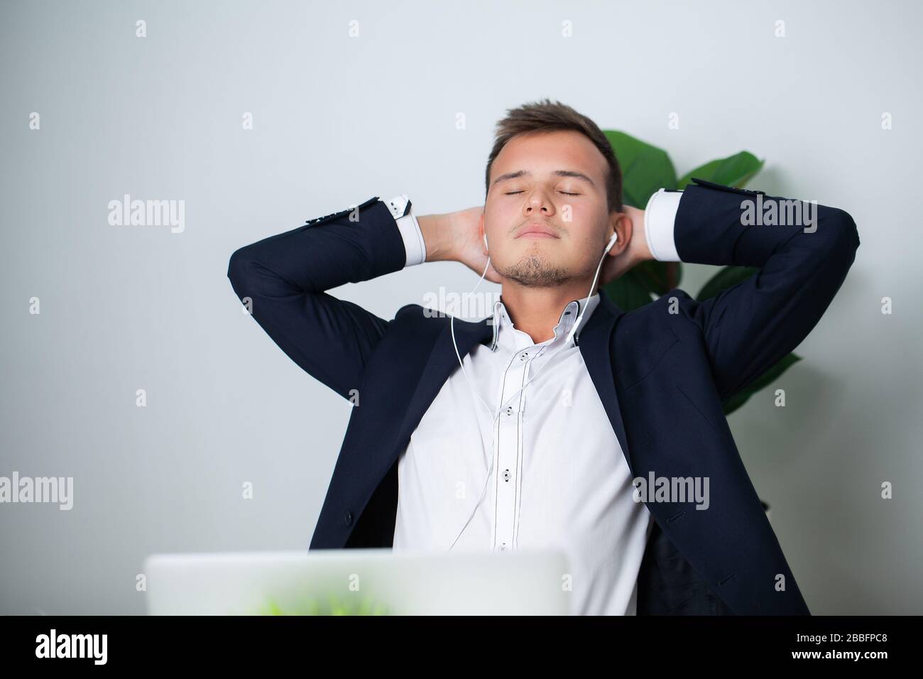Solid businessman talking on the phone with a client in the company ...