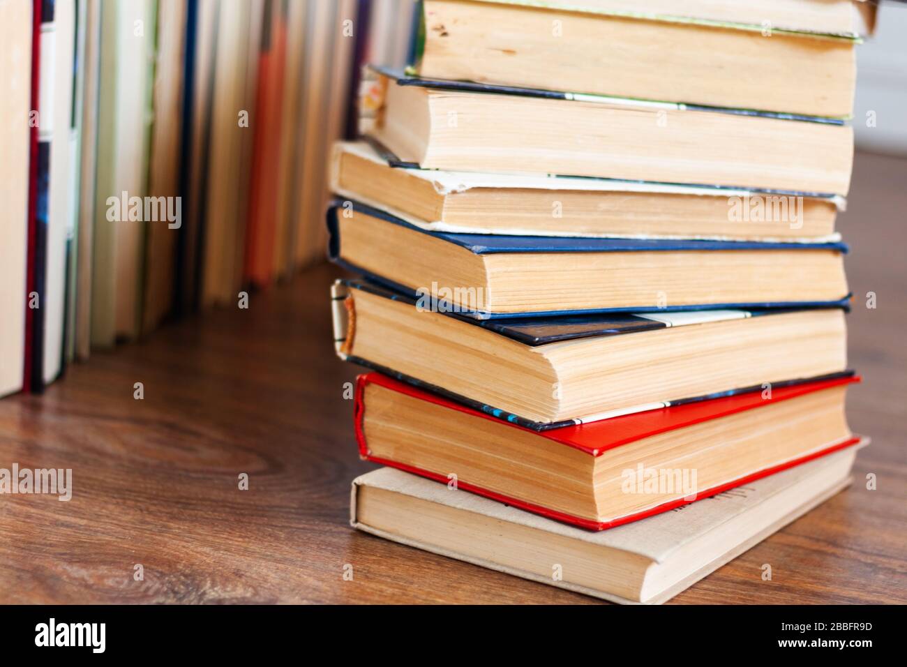 stack of old book on wooden table, education concept background, many ...