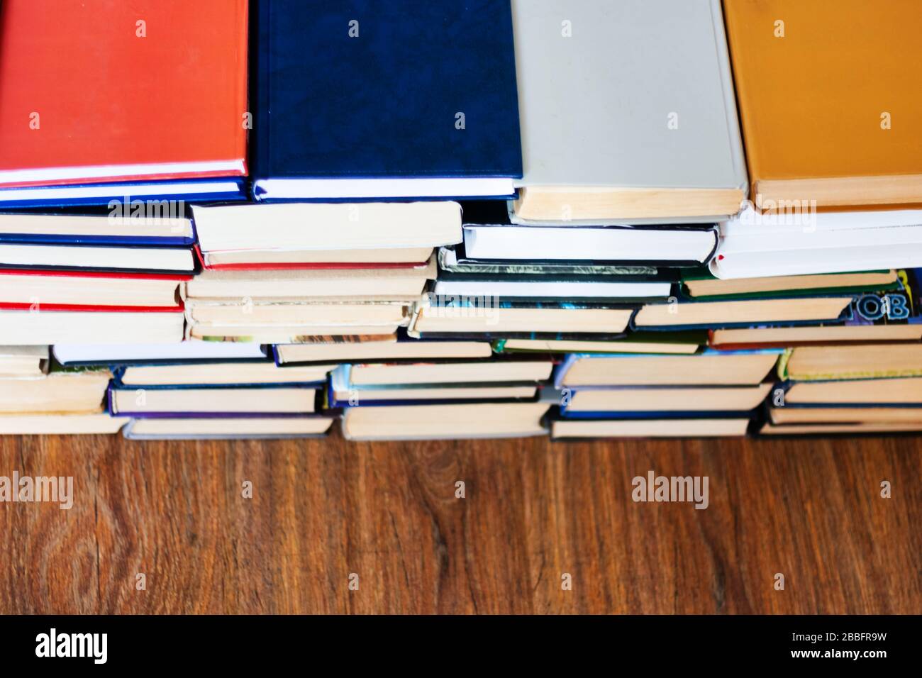 stack of old book on wooden table, education concept background, many ...