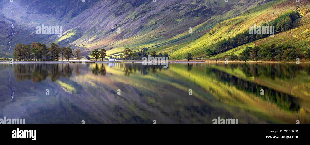 The famous Char Hut on the shore of Buttermere is highlighted by a ray ...