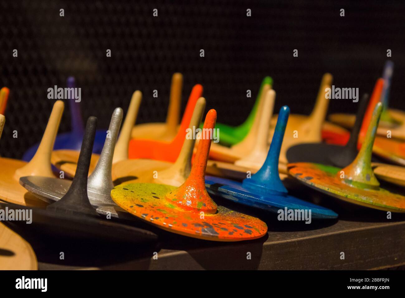 Handmade wooden peg tops or whirligigs as background Stock Photo - Alamy