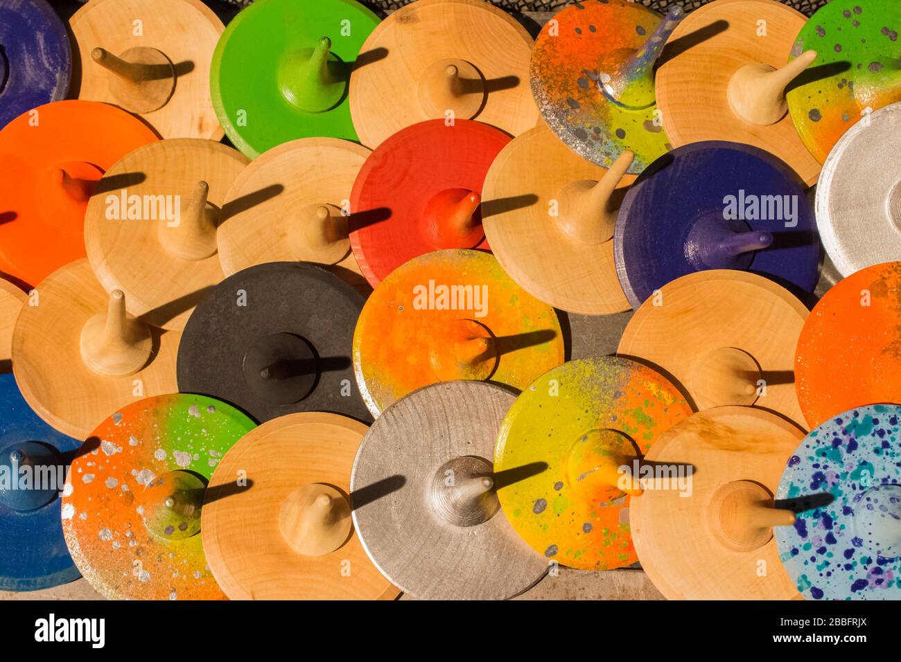 Wooden peg tops or whirligigs as background Stock Photo - Alamy