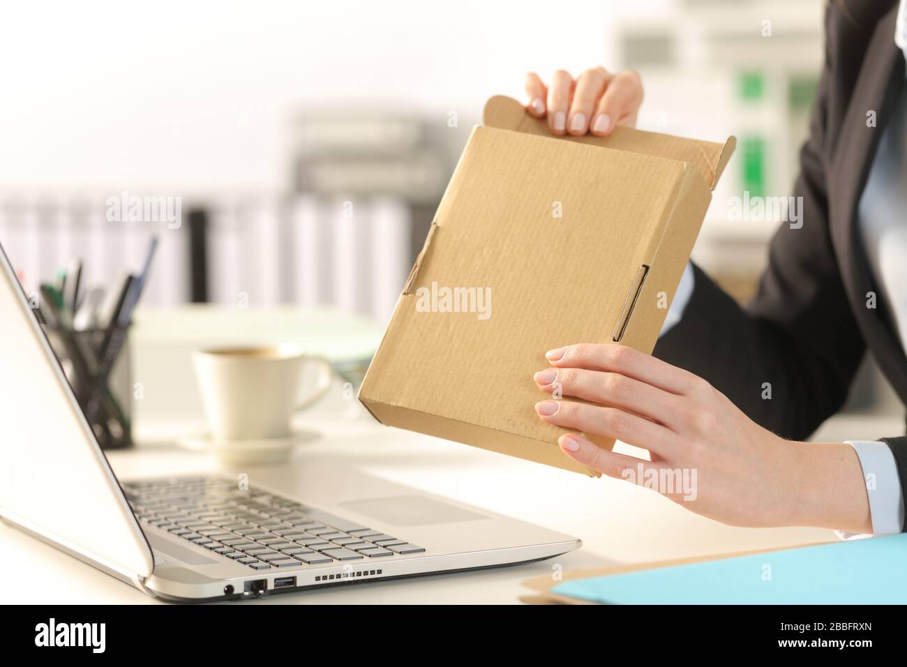 Woman opening package not happy hi-res stock photography and images - Alamy