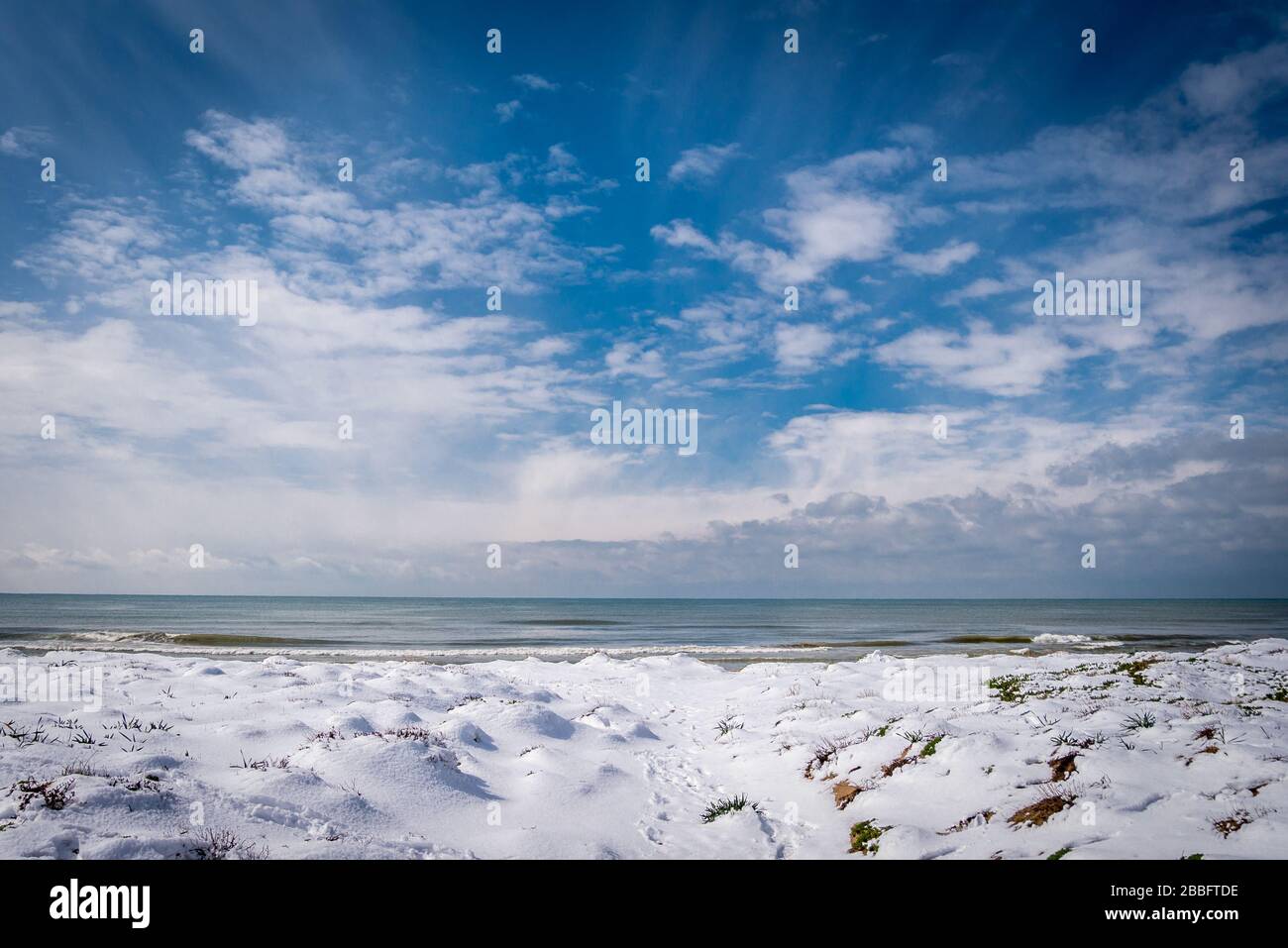 Unusual snow covers the sand of Naples beach, extraordinary snowfall on ...