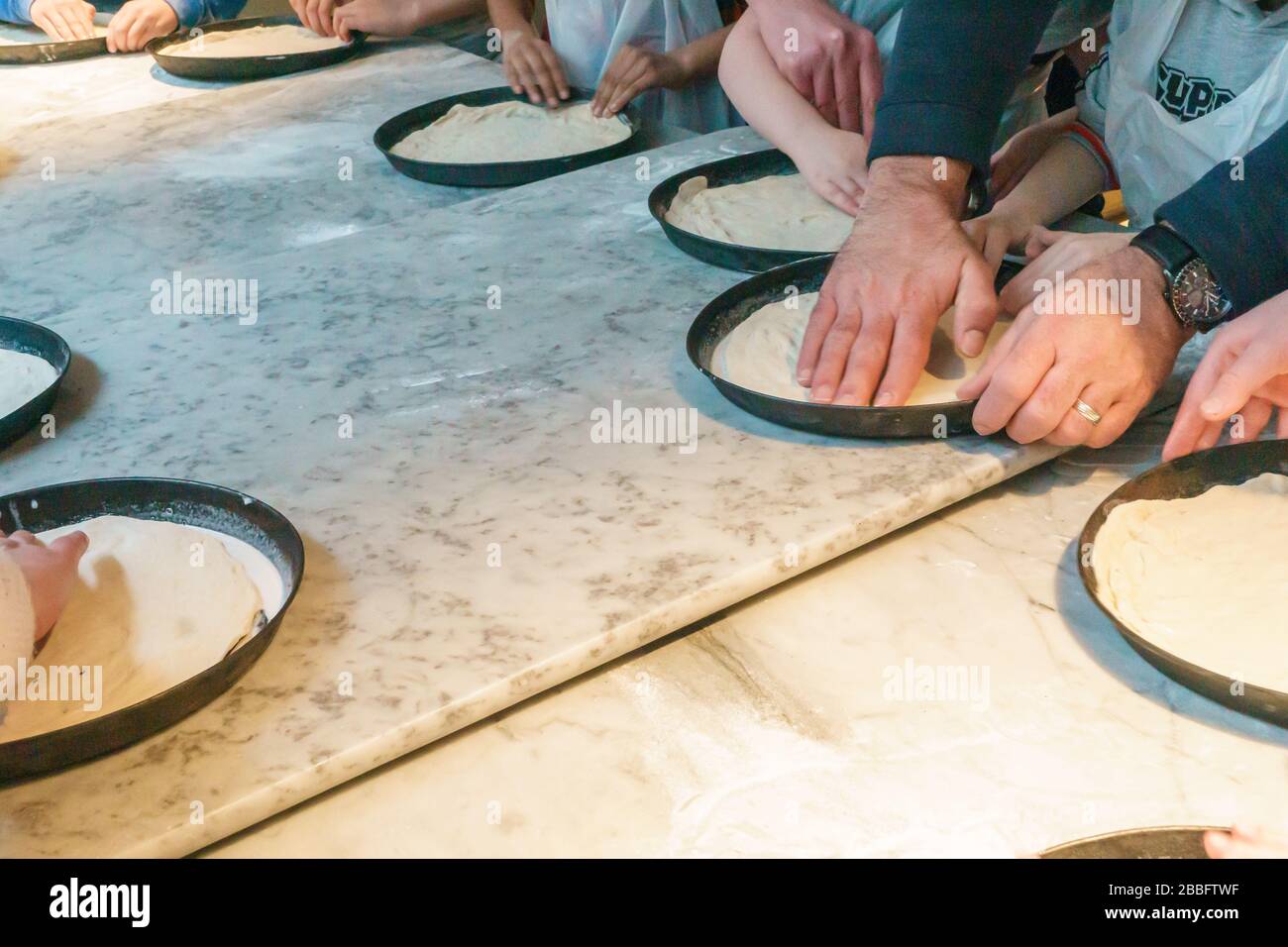 Children making pizzas in a class Stock Photo - Alamy