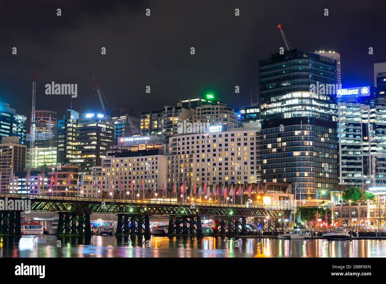 Darling Harbour at Sydney, Australia at night with pedestrian Pyrmont ...