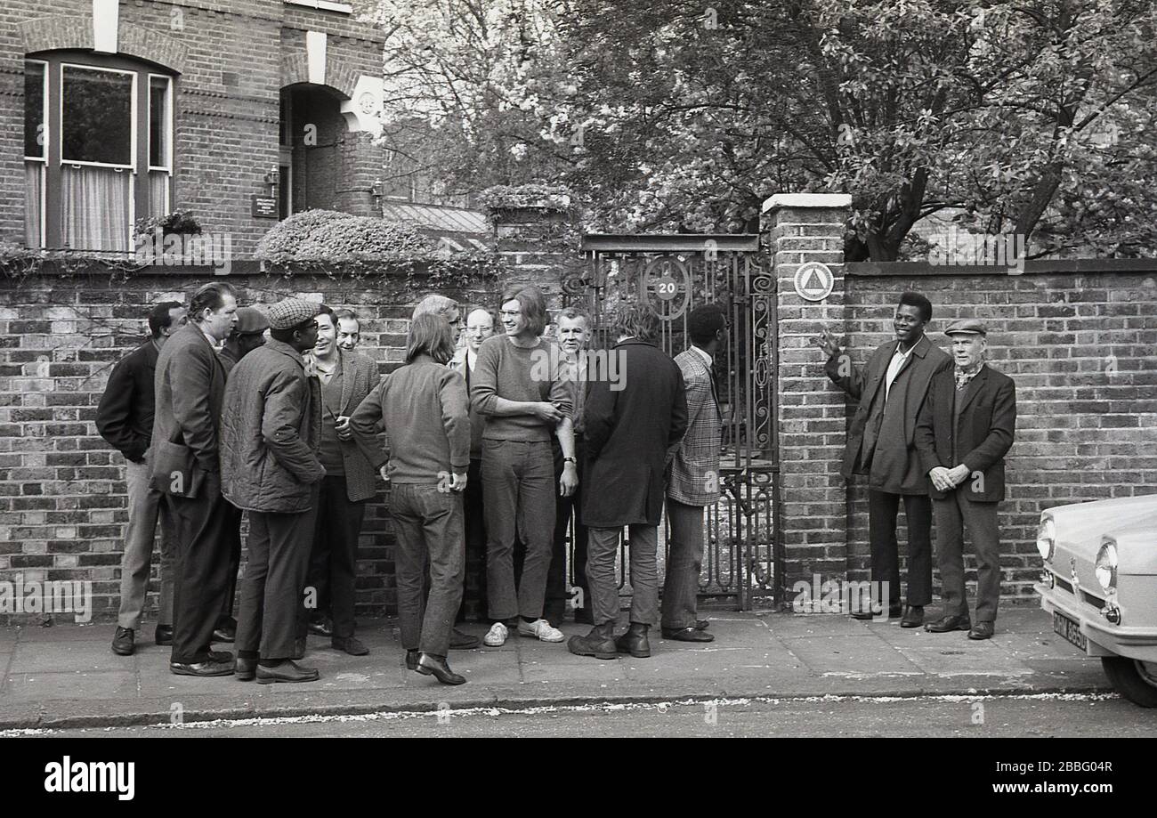 1970s, historical, a group of workers and union members gathered in ...