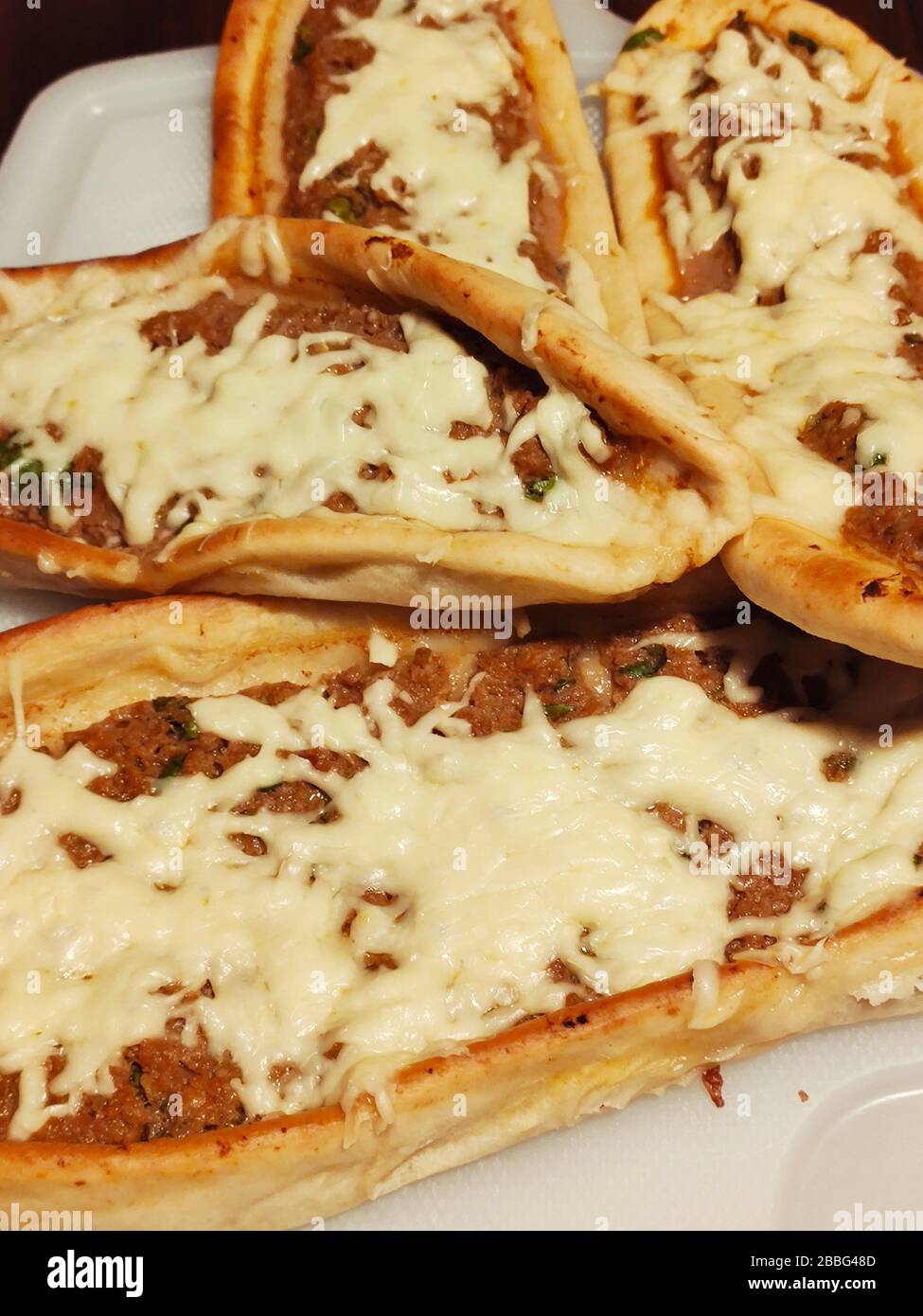 Turkish Traditional Pide with ground beef, onion, tomato and pepper ...