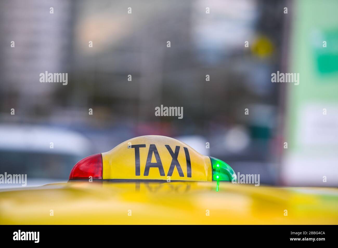 Taxi sign with red and green lights on the roof Stock Photo - Alamy