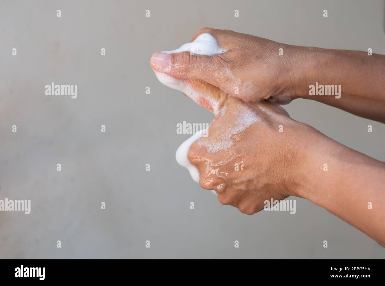 Muslim women wash hand with soap alcohol gel for sanitizer in kitchen ...