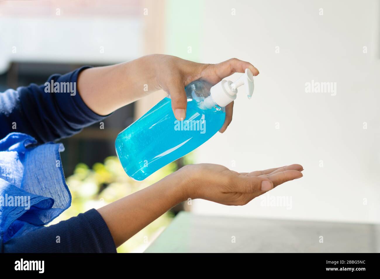 Muslim women wash hand with soap alcohol gel for sanitizer in kitchen ...