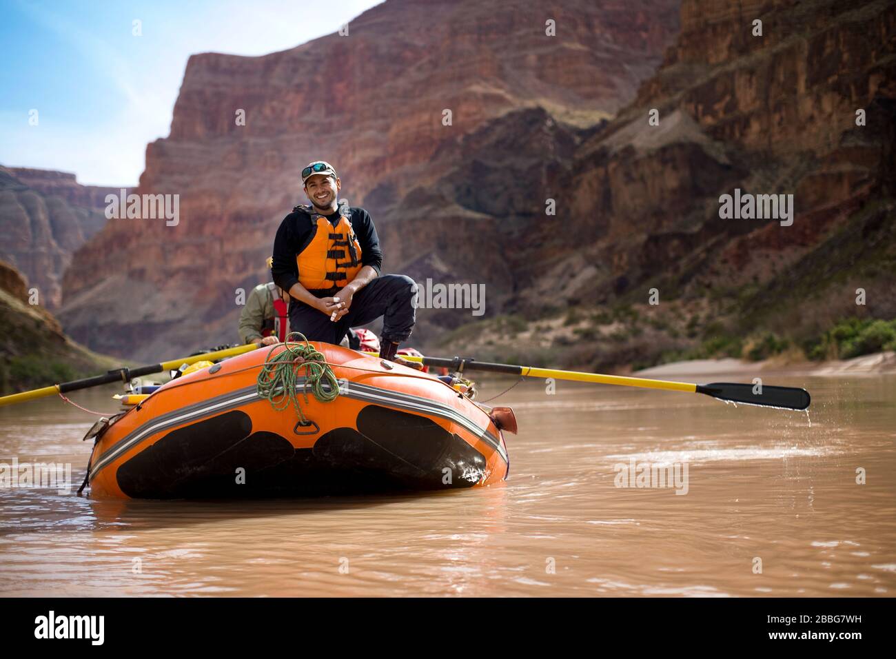 Portrait of a smiling man on a raft Stock Photo - Alamy