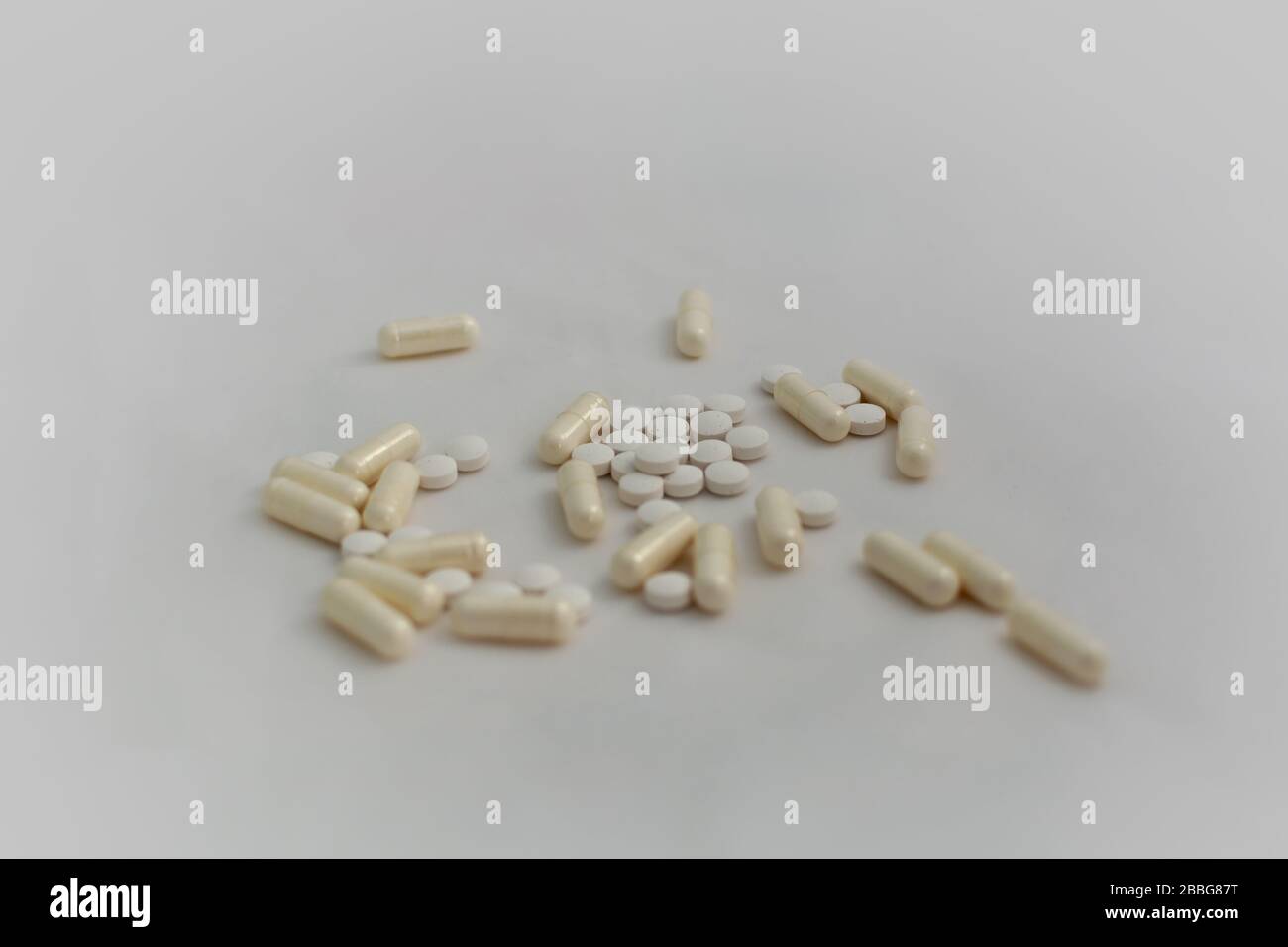 Bunch of pills - tablets and capsules - on white background Stock Photo ...
