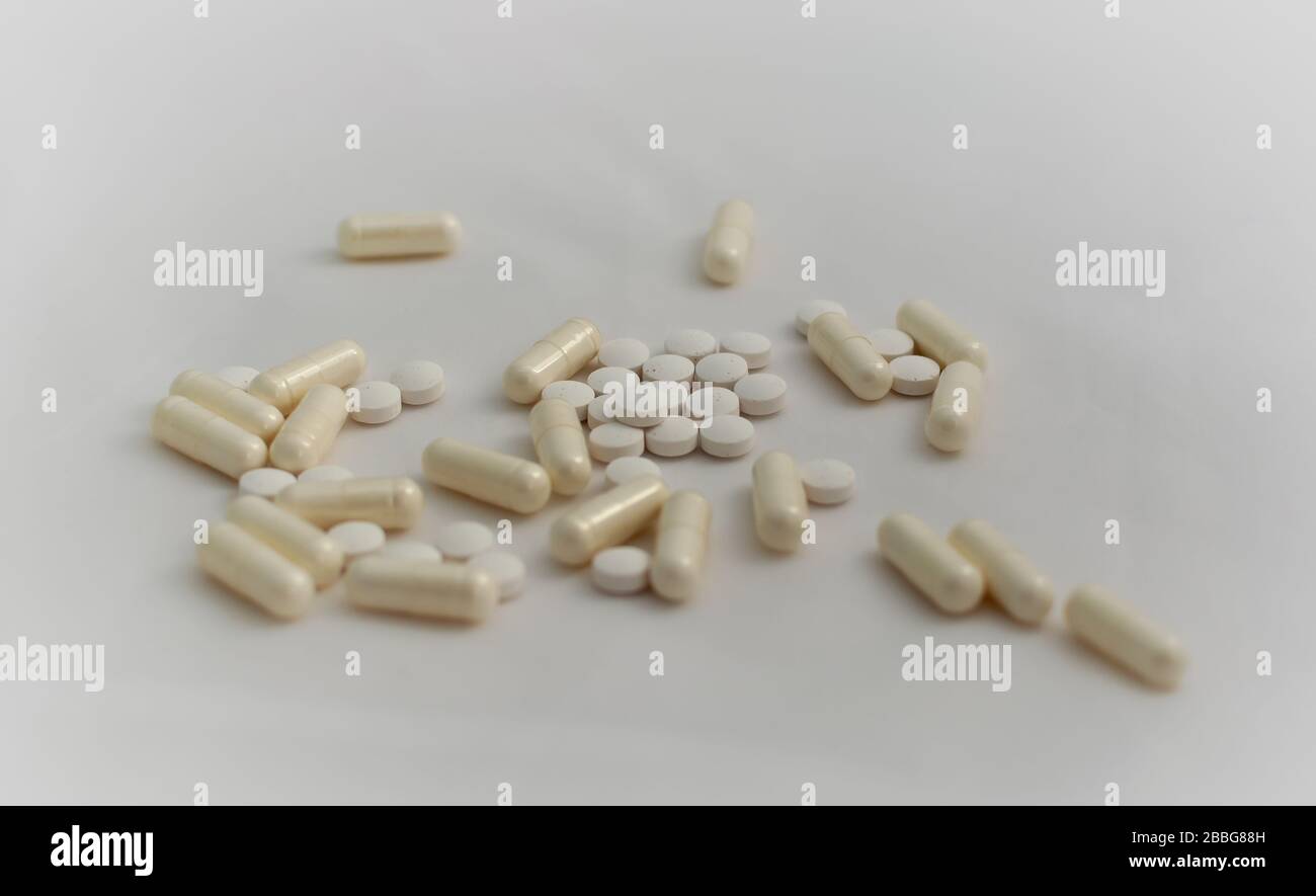 Bunch of pills - tablets and capsules - on white background Stock Photo ...