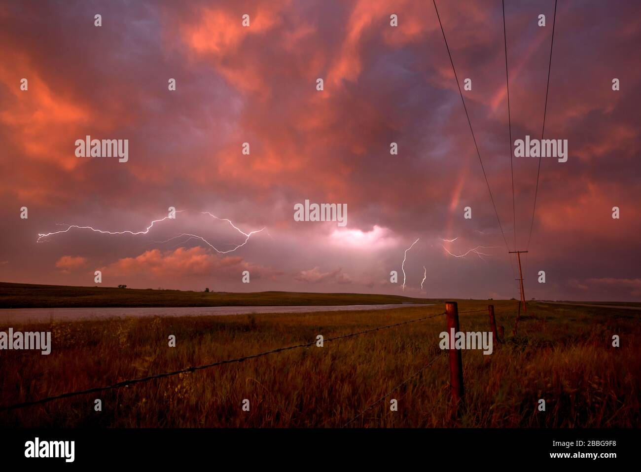 Storm with lightning flashing at sunset in rural Saskatchewan, Canada ...