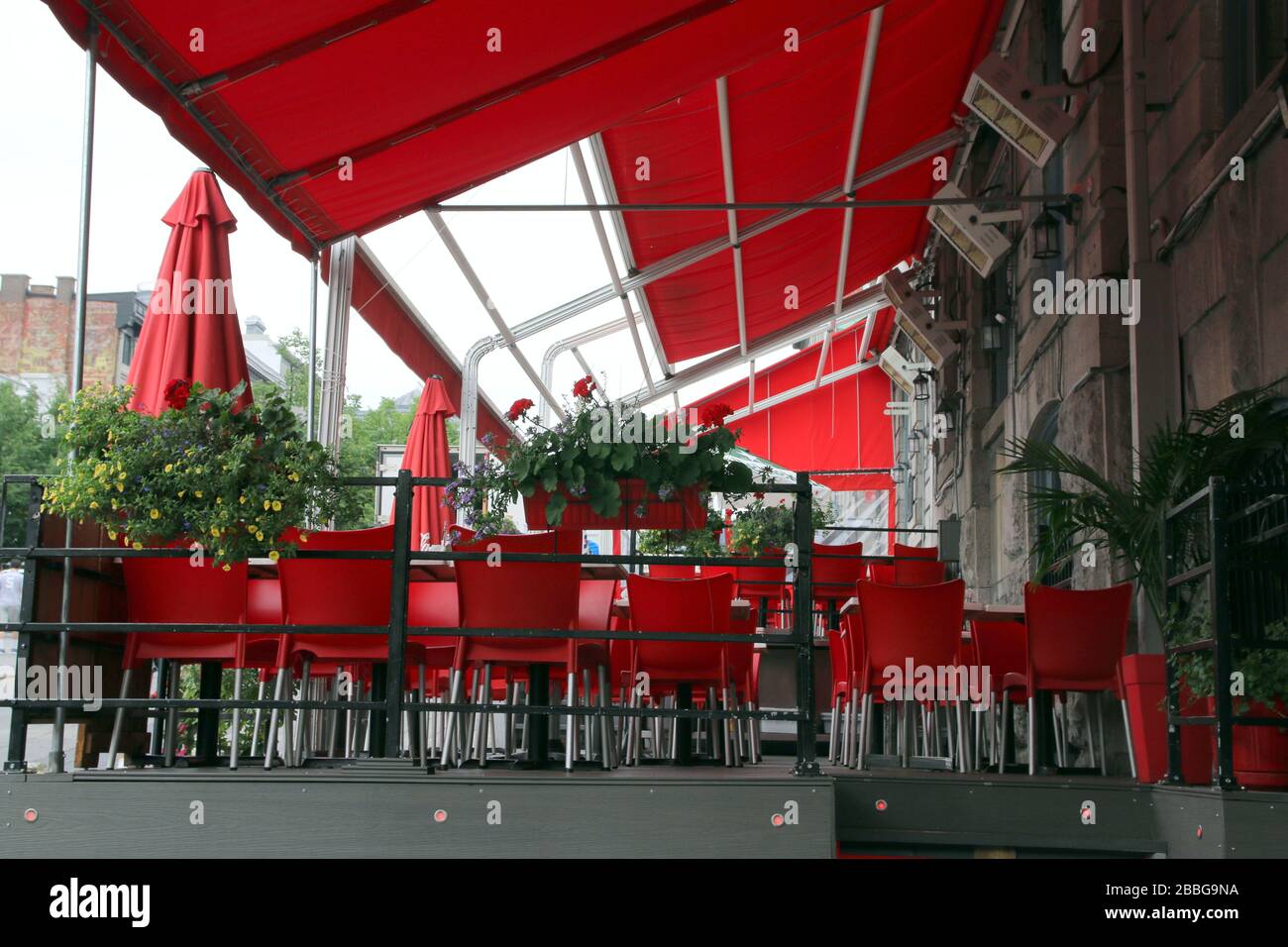 The outdoor cafe is decorated in bright red Stock Photo - Alamy