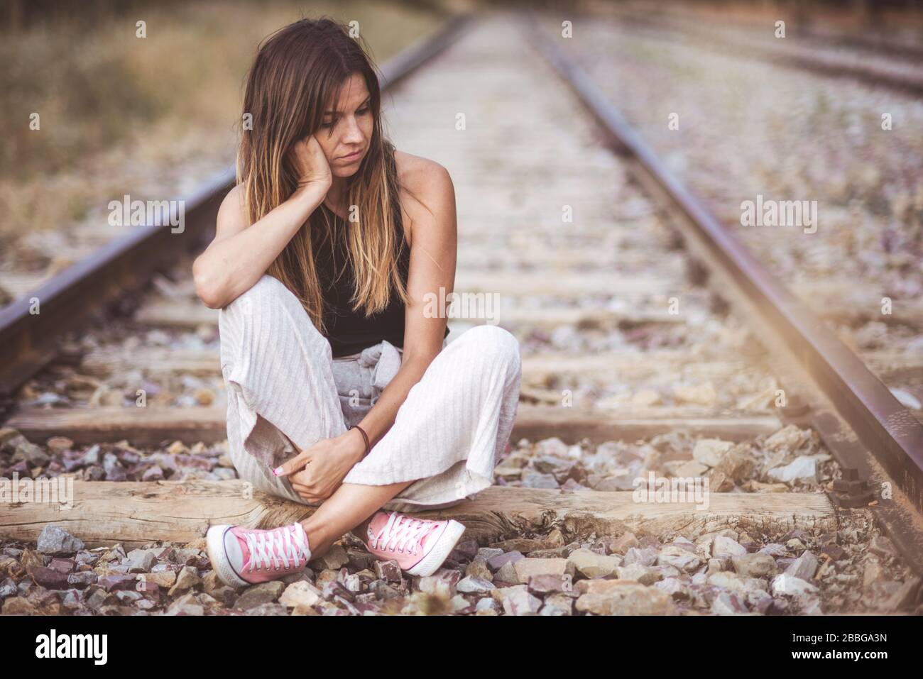Girl standing on railroad track hi-res stock photography and images - Alamy