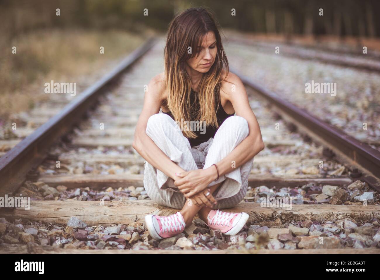 Girl standing on railroad track hi-res stock photography and images - Alamy