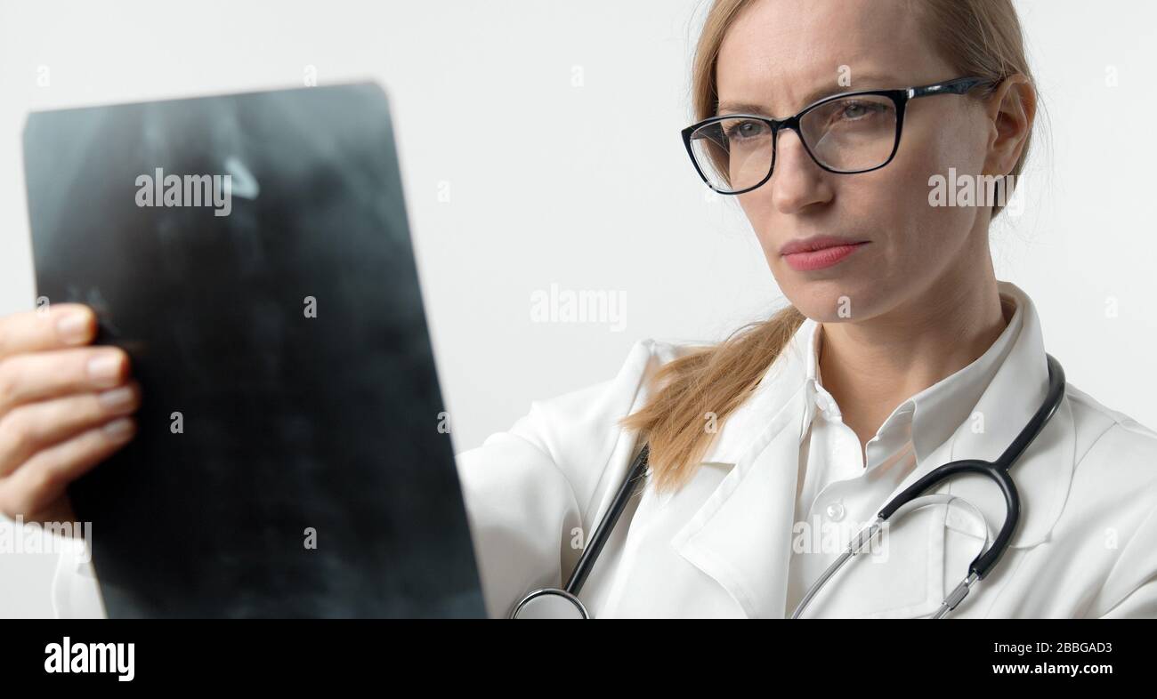 Female doctor examining x-ray picture Stock Photo - Alamy