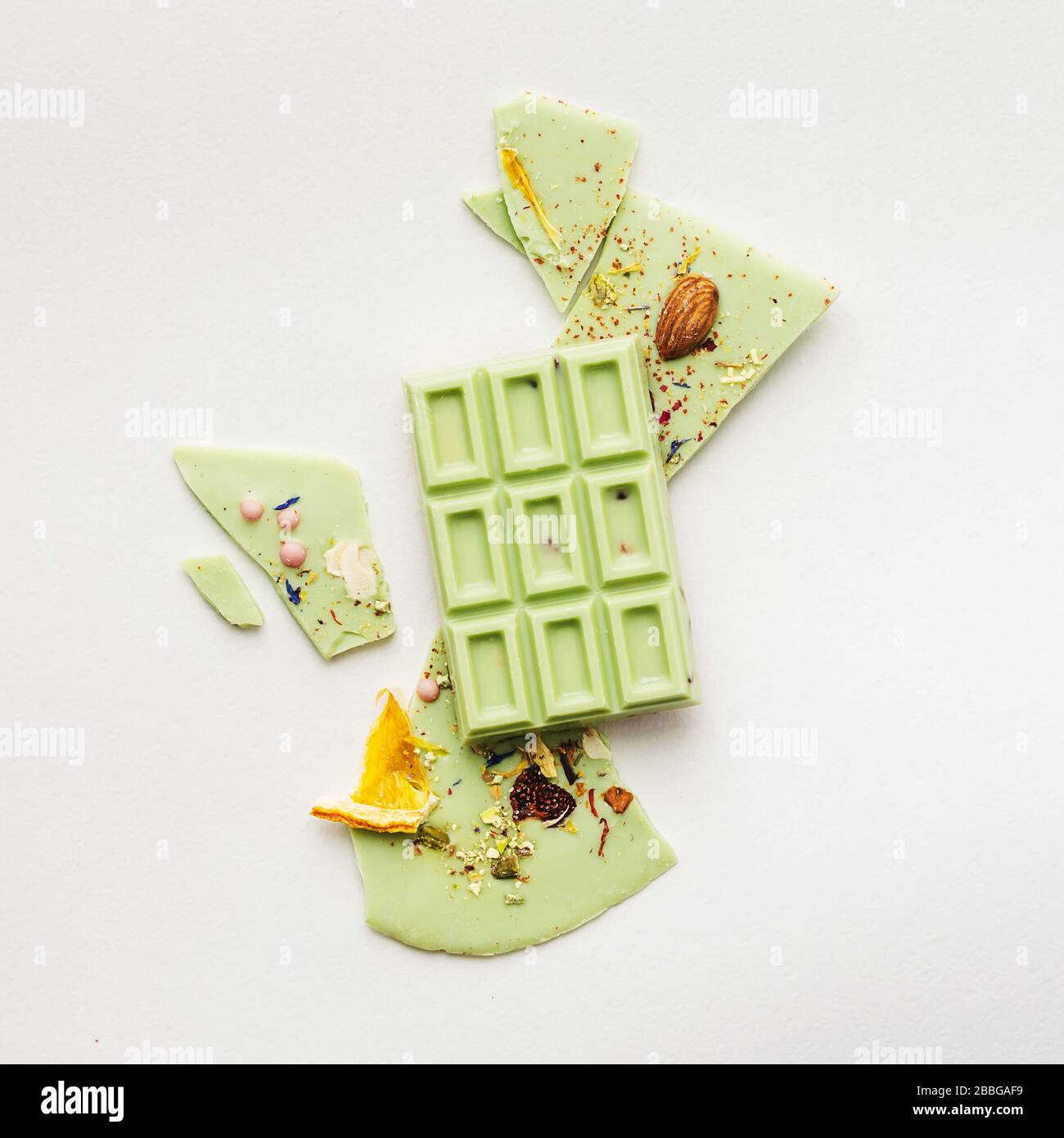 Chocolate bar whole with the addition of pistachios white isolated ...