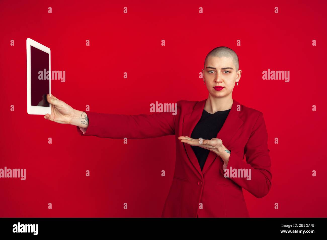 Taking selfie or vlog. Portrait of young caucasian bald woman isolated ...