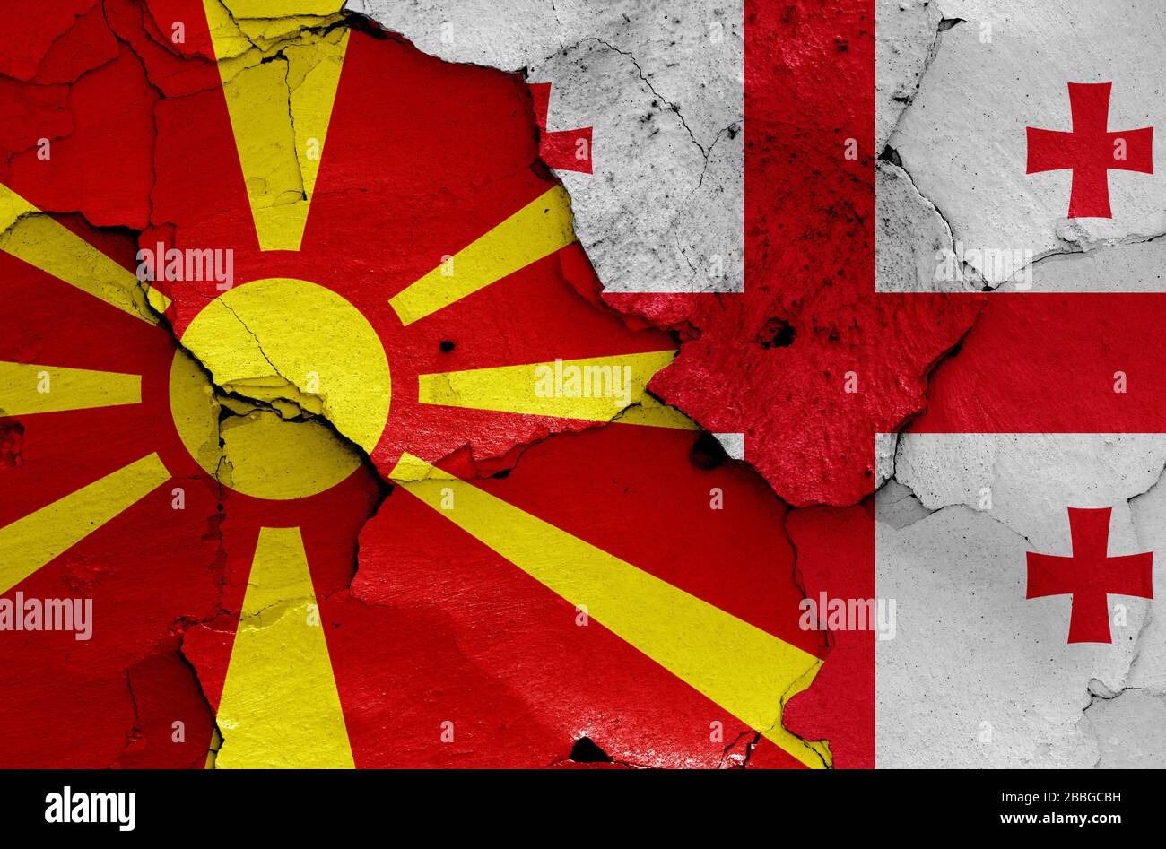flags of North Macedonia and Georgia painted on cracked wall Stock ...