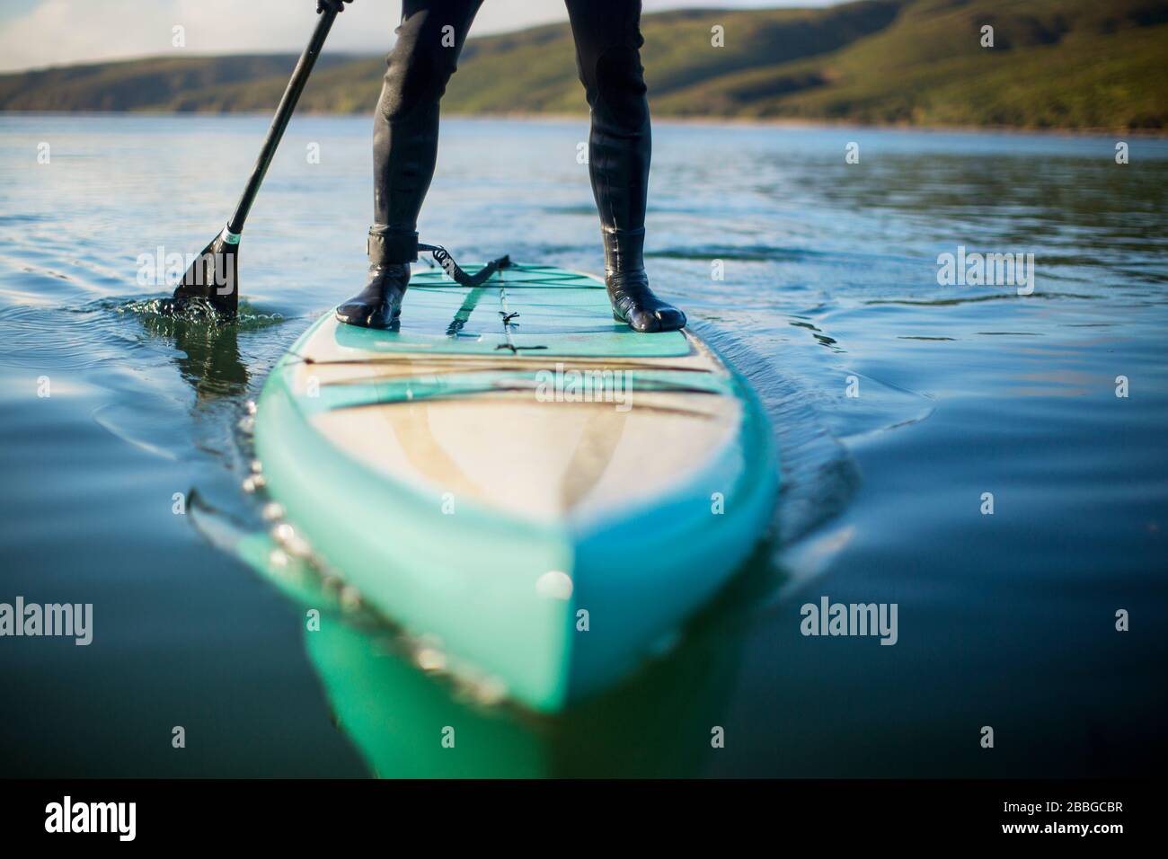Feet of a paddle boarder on a lake Stock Photo - Alamy
