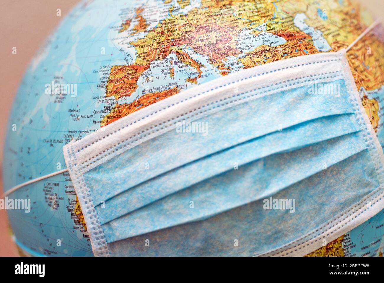 Planet Earth with a mask on Stock Photo - Alamy