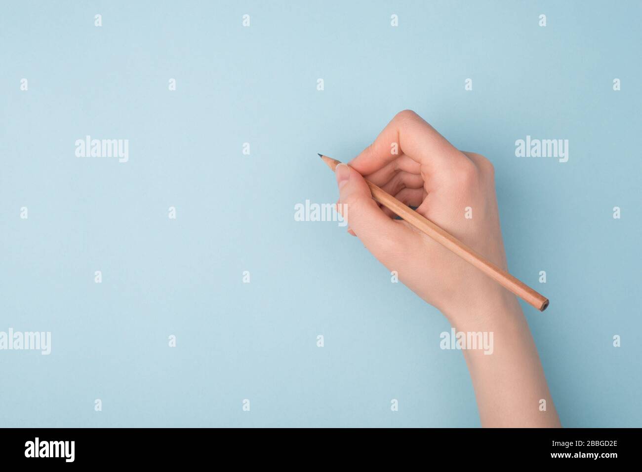 Top close up pov above overhead view photo of hand holding wooden ...