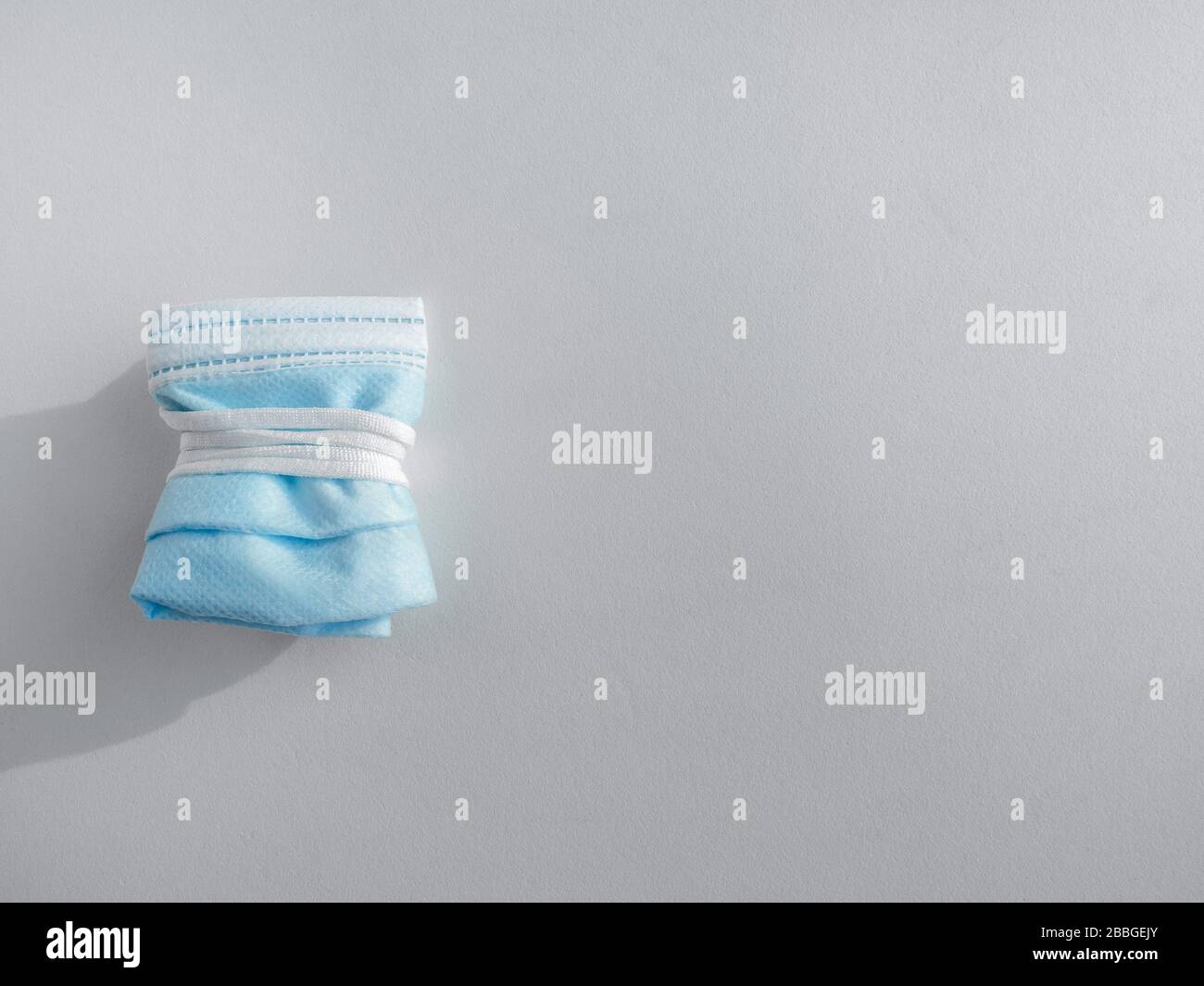 Used mask concept. Folded used protective face mask isolated on white ...