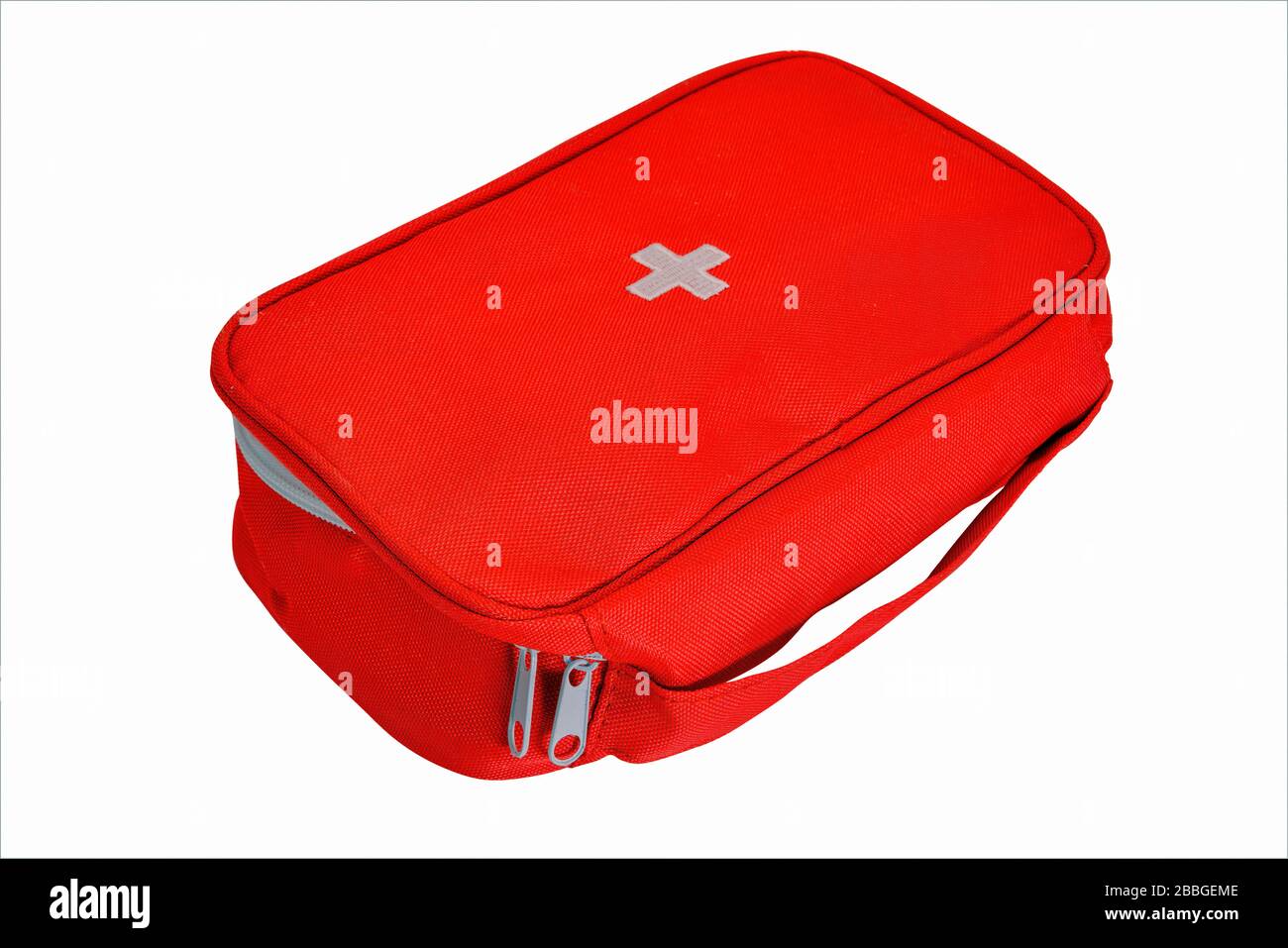 Top view on the red first aid kit box close-up isolate on a white ...