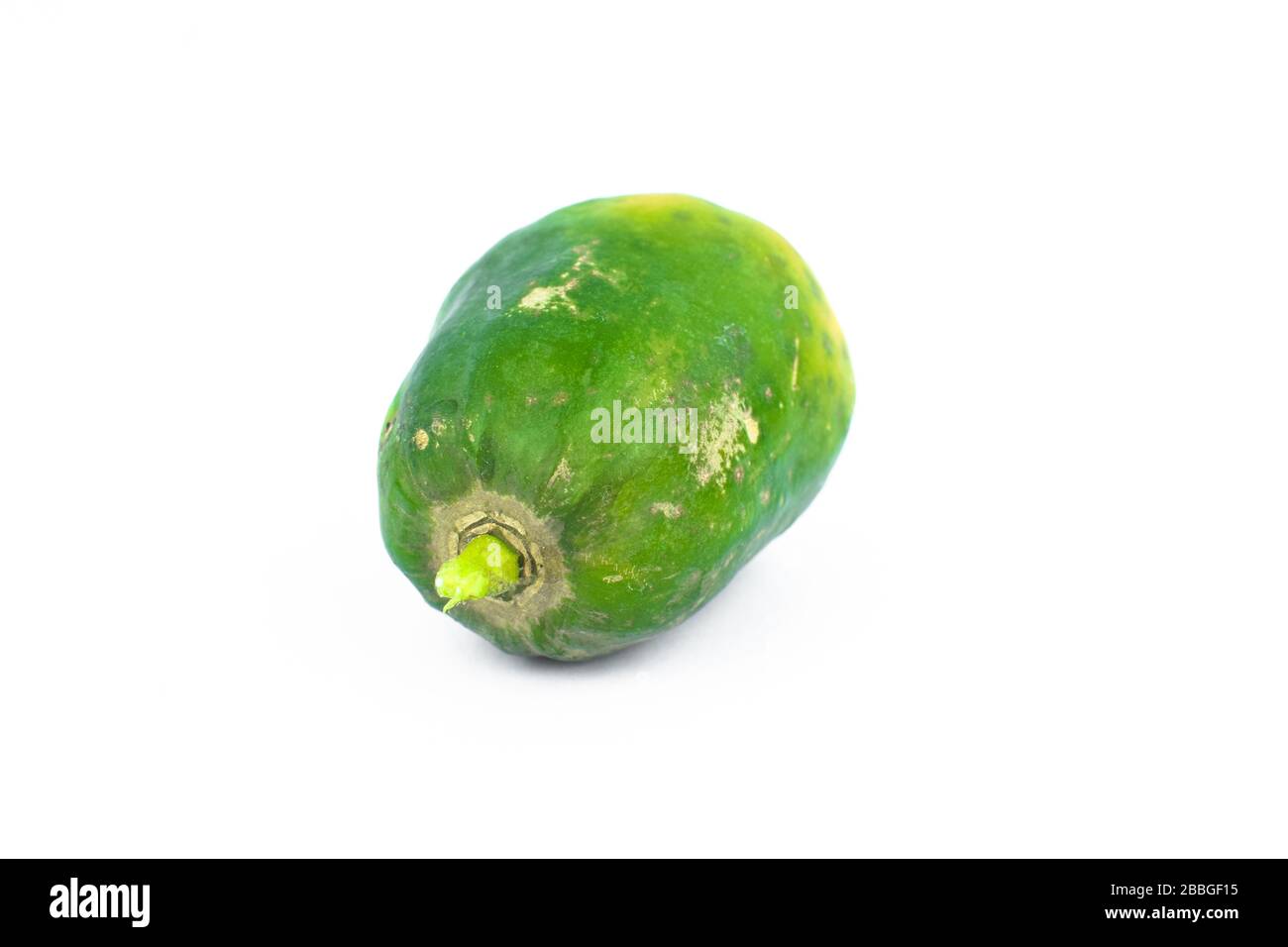Portrait of a fresh green medium sized papaya fruit isolated on an ...