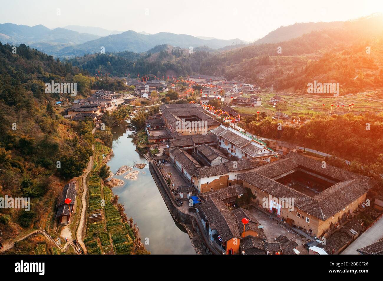 Aerial view of Tulou at sunset, the unique dwellings of Hakka in Fujian ...