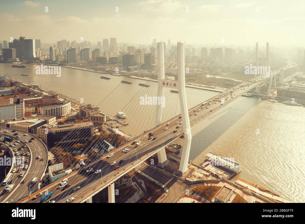Shanghai Nanpu Bridge over Huangpu River with busy traffic in China ...