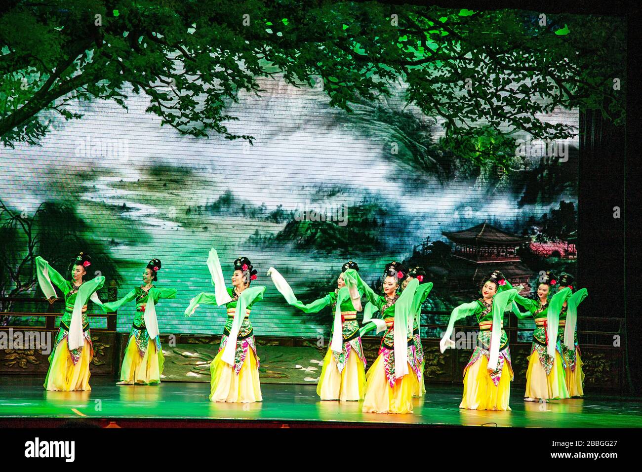 Female Chinese dancers performing traditional feathered coat dance on ...