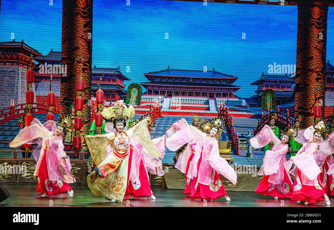 Female Chinese dancers performing traditional feathered coat dance on ...