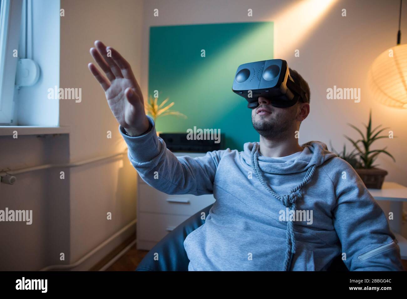men in lazy bag enjoying vr at home virtual reality googles Stock Photo ...