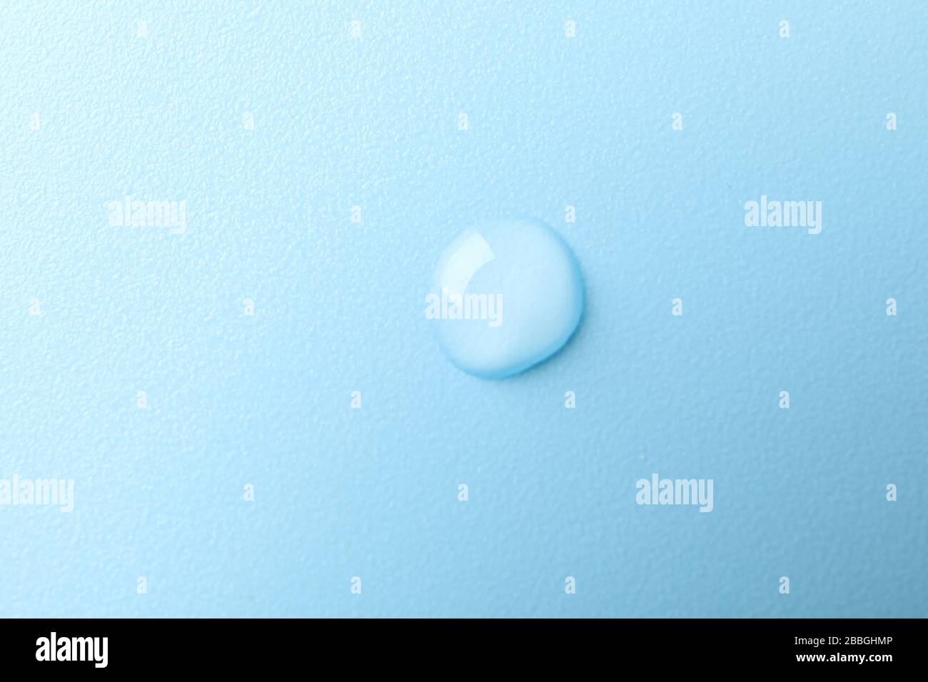Water drop on blue background, close up and top view Stock Photo - Alamy