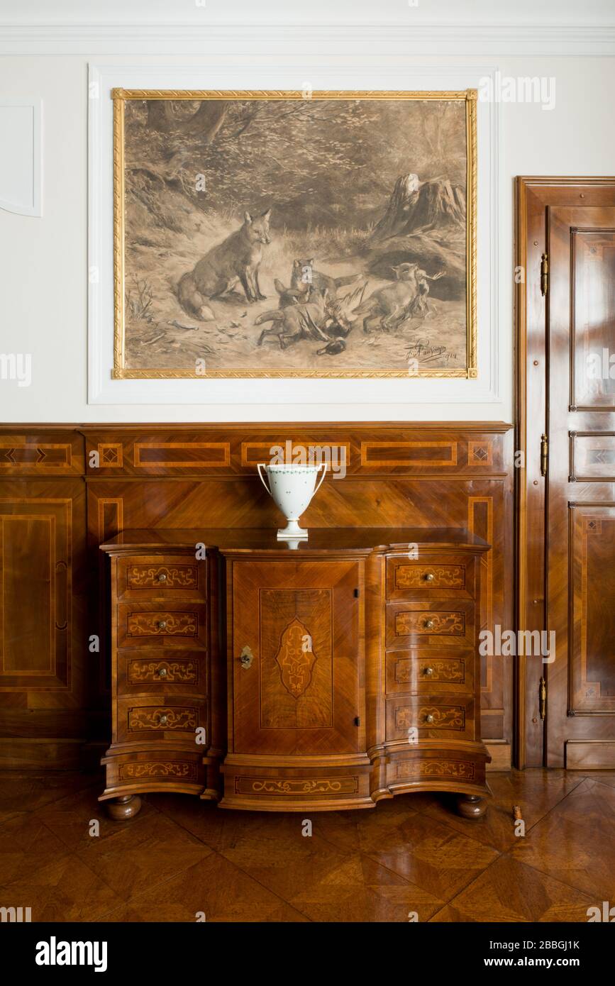 elegant historic dining room with wood paneling and paintings by Franz ...