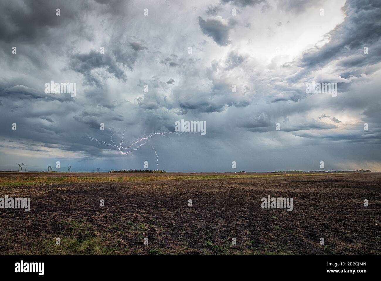 Lightning striking over field in rural southern Manitoba Canada Stock ...