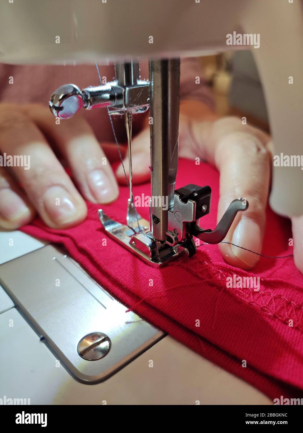 Close-up shot of needle and thread of modern sewing machine Stock Photo ...